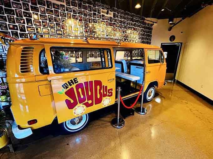 The iconic orange bus sits inside surrounded by photos documenting countless meals served and lives touched throughout Phoenix.