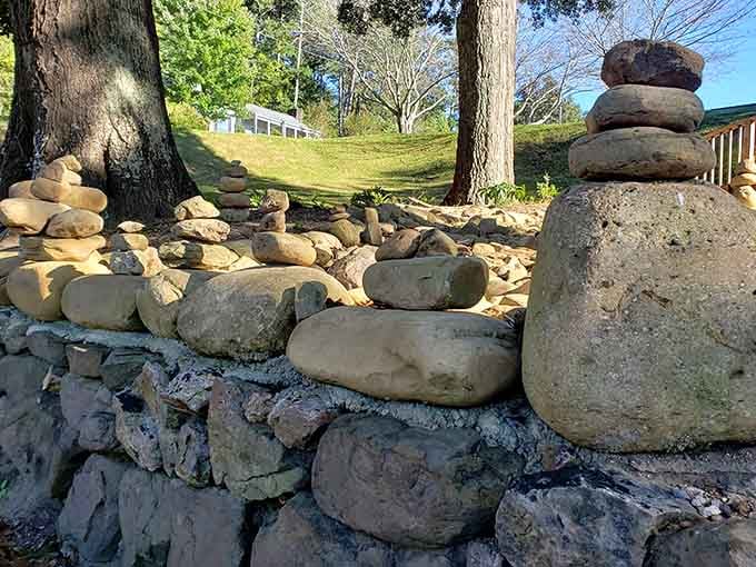 Visitors have stacked stones in careful cairns, leaving their own small mark on this contemplative space with ancient tradition.