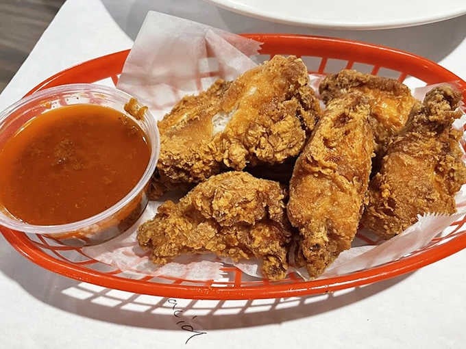Crispy fried chicken tenders proving this place understands not everyone's ready to commit fully to the shellfish lifestyle.