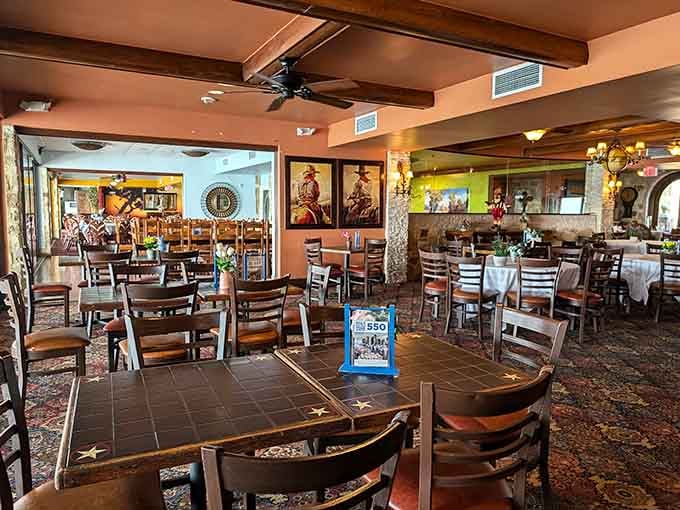 Tile-topped tables, wooden chairs, and Western artwork on warm walls, casual enough for lunch, charming enough for a special night.