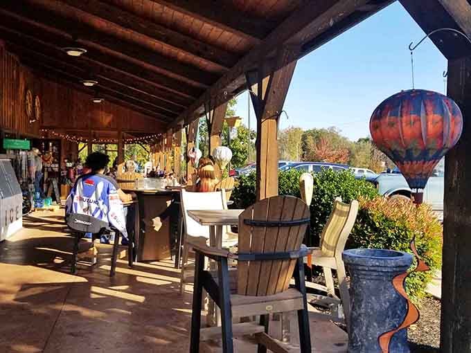 Covered outdoor seating with string lights and Adirondack chairs, perfect for enjoying your haul without crumbs in the car.