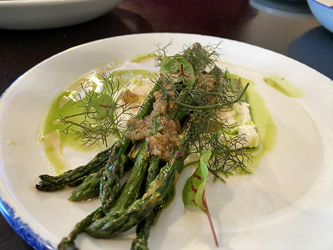Fresh asparagus with delicate garnishes transforms a simple vegetable into something worthy of celebration&mdash;spring on a plate, perfectly executed.