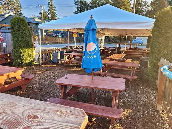 Picnic tables under canopies where the dress code is "comfortable" and the vibe is pure relaxation.