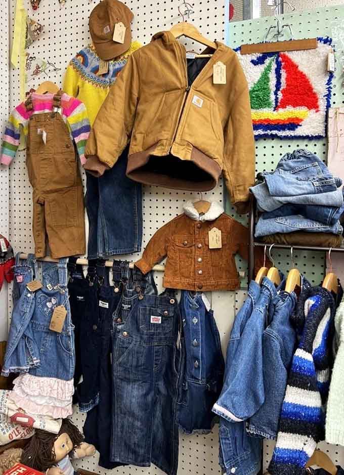 Vintage denim and leather jackets hanging like a thrift store time capsule from decades past.