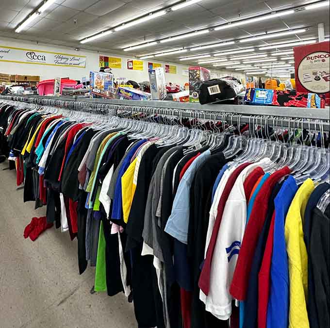 Every color of the rainbow hangs here on identical hangers, turning casual wear into an organized spectrum.