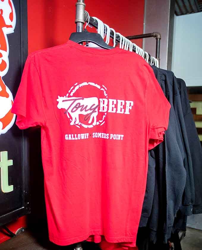 Bright red merchandise proudly displays the Tony Beef logo, because when burgers are this good, you want to advertise.
