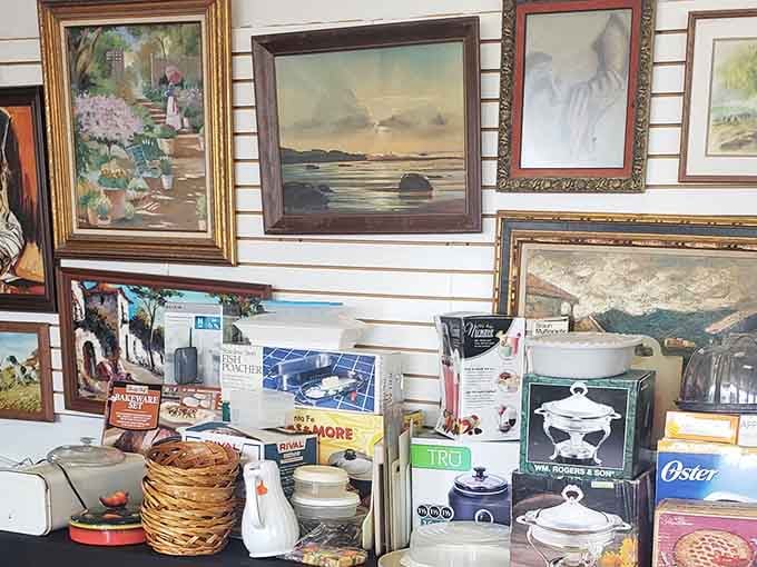 Wall art and kitchen gadgets proving that one person's attic cleanout is another person's decorating solution jackpot.