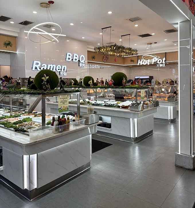 Buffet stations organized by cuisine type make navigating your unlimited eating journey logical and surprisingly stress-free for everyone.