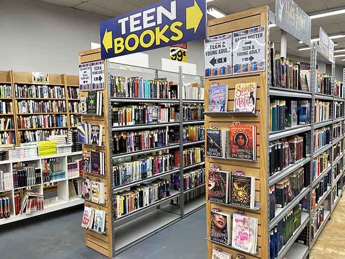 The teen section, where young adult fiction lives alongside actual young adults discovering the magic of reading.