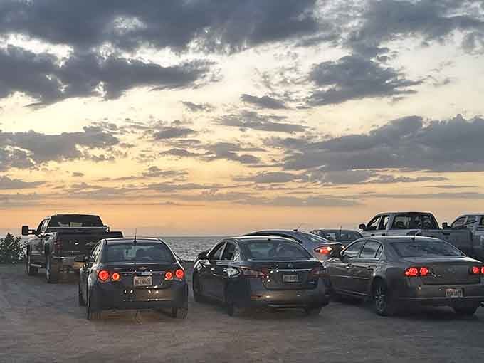 Cars lined up for sunset viewing like it's a drive-in movie, except the show is completely free.