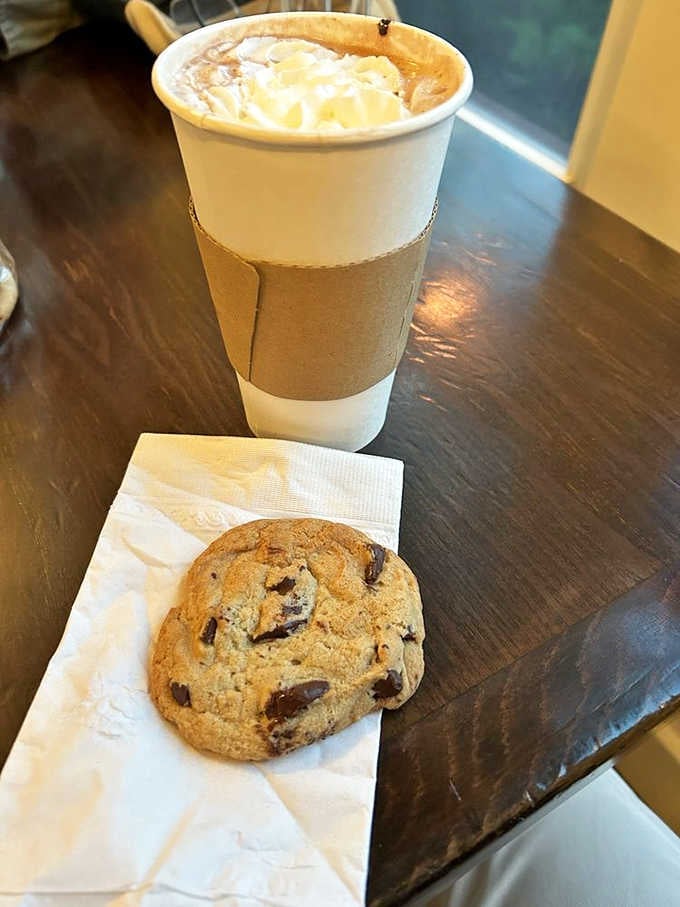 Hot chocolate topped with whipped cream and a chocolate chip cookie is basically a hug in beverage form.