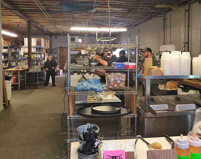 Behind the scenes where the magic happens &ndash; organized chaos fueled by smoke, passion, and serious culinary dedication.