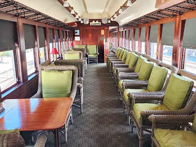 Step inside this vintage carriage where wicker seats and wood paneling defined comfortable travel for generations past.