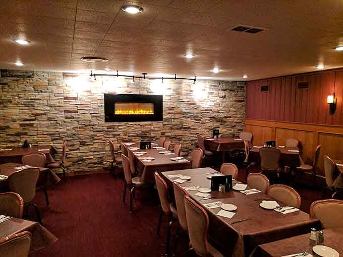 Multiple dining rooms with stone accents and warm lighting create intimate spaces perfect for any special occasion celebration.