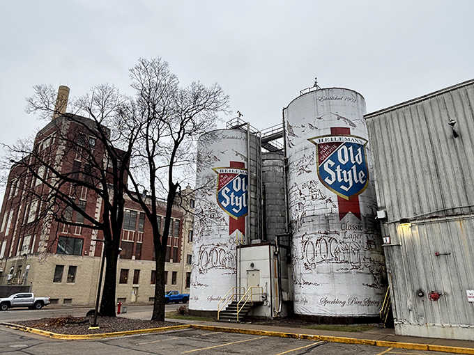 The weathered brick building provides perfect contrast to the gleaming white tanks, old meets older in perfect harmony.