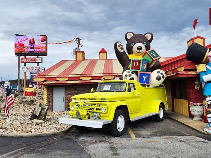 A cheerful yellow truck and giant teddy bear, because normal-sized outdoor decorations are for quitters obviously.