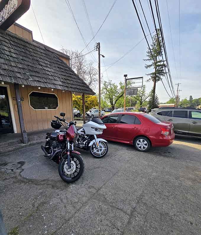 A motorcycle parked outside hints at the freedom these backroads offer to anyone seeking escape.