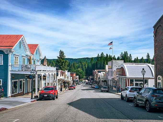 Red-roofed buildings march up the street toward pine-covered ridges, blending Gold Rush history with mountain town magic.
