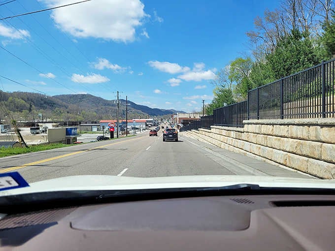 Blue skies and mountain peaks frame this perfect drive through valleys where time moves just right.