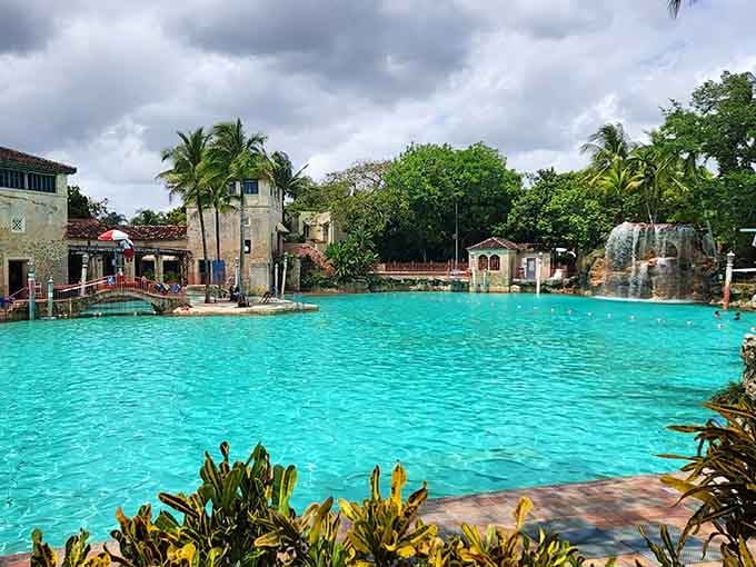 That turquoise glow beckons swimmers to dive into what feels like a movie set come to life.