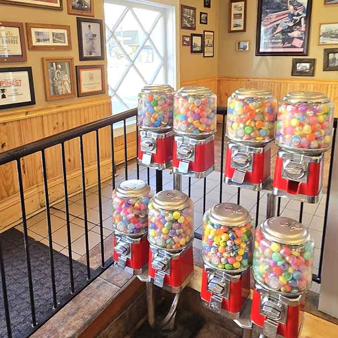 Old-school gumball machines line the wall, because if you're doing nostalgia, you might as well commit completely.