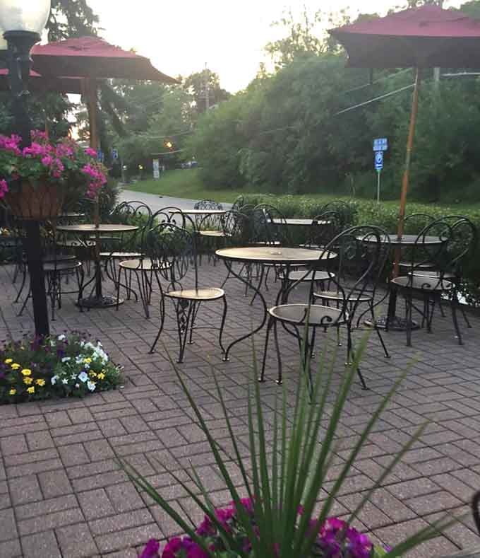 Evening light filtering through the trees onto empty patio tables, waiting patiently for tomorrow's crowd of custard seekers to return again.