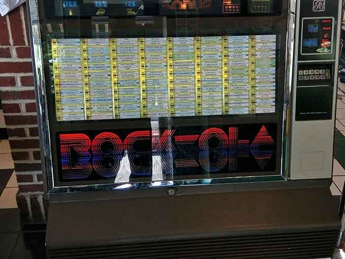 A vintage Rock-Ola jukebox stands ready to soundtrack your breakfast with tunes from when diners ruled the world.