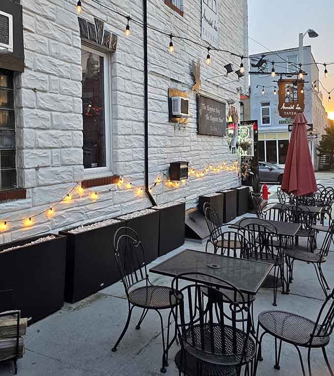 String lights illuminate the outdoor patio, transforming a Canton sidewalk into an enchanting evening dining destination.