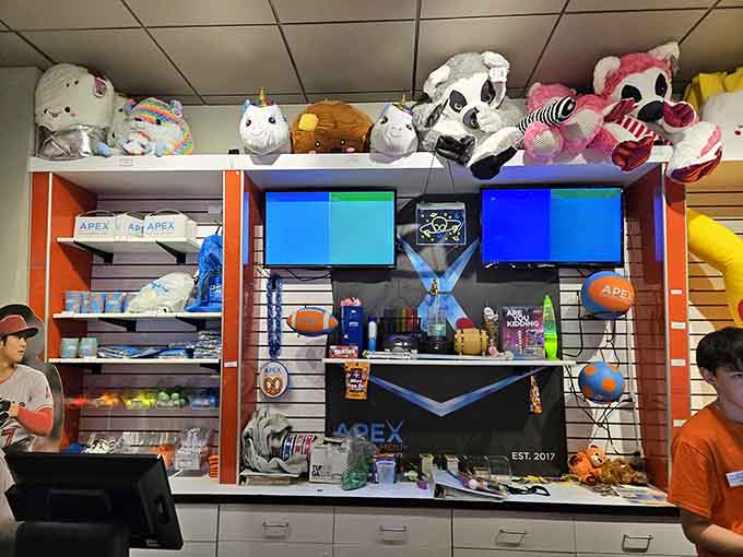 Prize counters stocked with stuffed animals prove that winning tickets creates joy regardless of your age or dignity level.