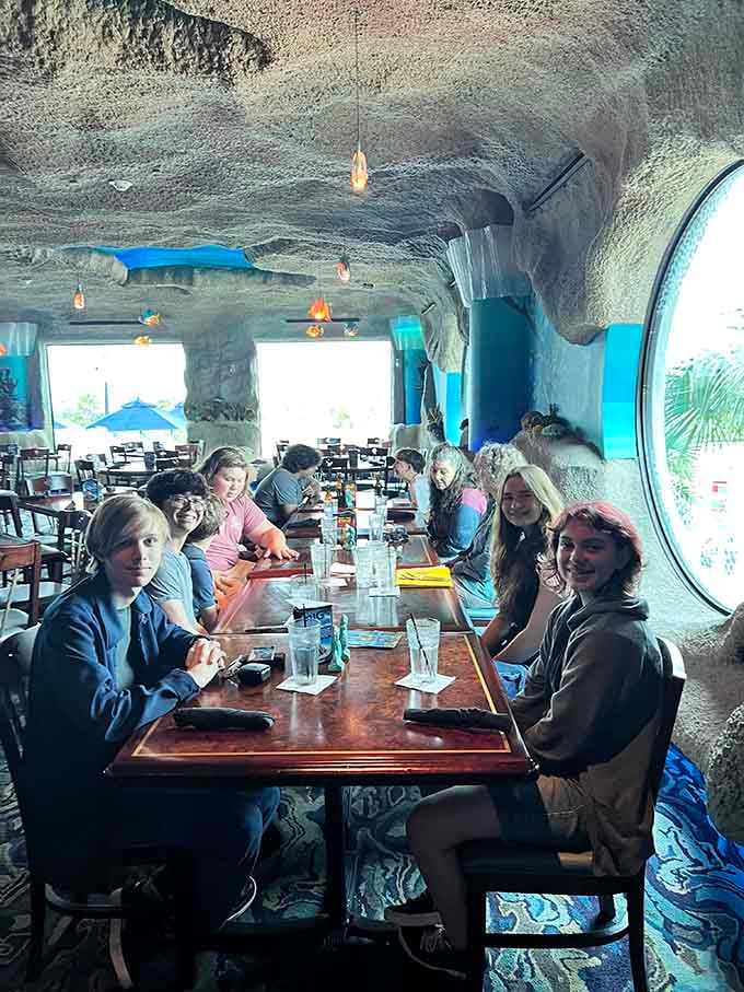 Happy diners surrounded by swimming fish proves that dinner and entertainment really can coexist beautifully here.
