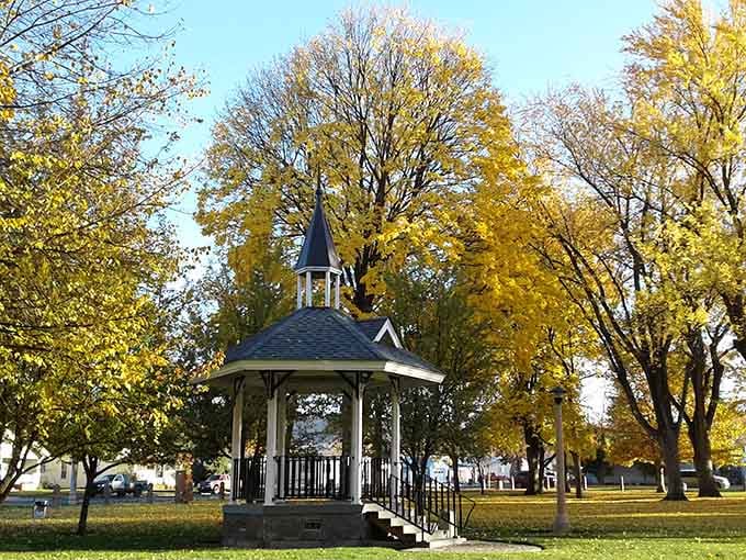 A charming gazebo offers shade and community gathering spots that social media could never replicate properly.