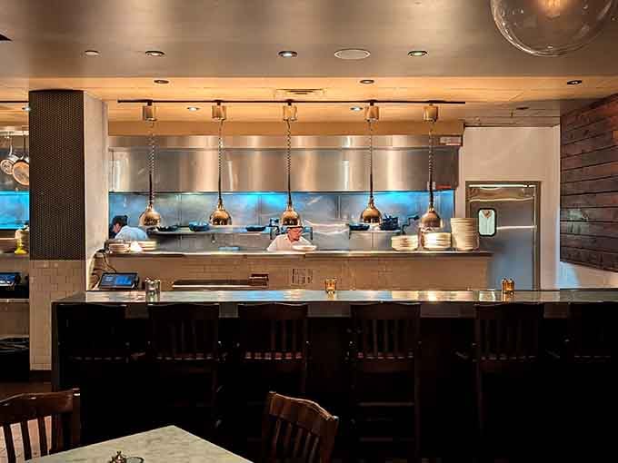Behind that gleaming kitchen window, skilled hands are creating the pasta dishes that'll haunt your dreams tonight.