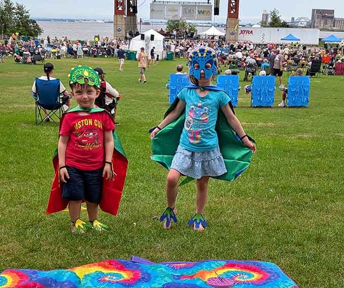 Young superheroes strike poses at festival events, because every great park needs its own caped crusaders.
