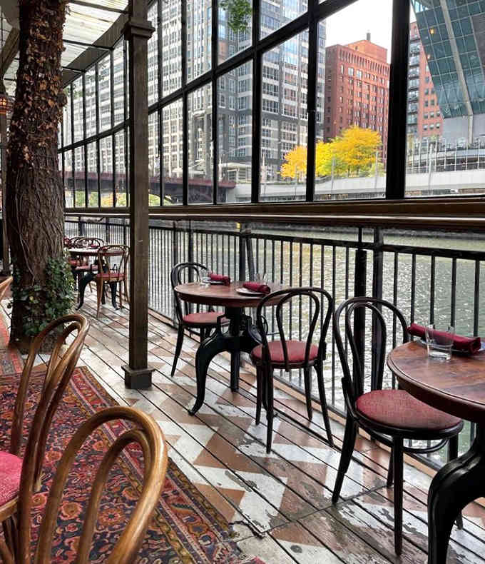 River views and bistro chairs: proof that the best dining experiences happen when you can watch the world float by, literally.