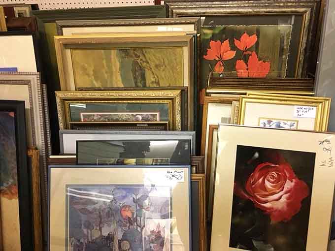 Framed art stacked deep offers everything from roses to landscapes, turning your home into a museum on a thrift budget.