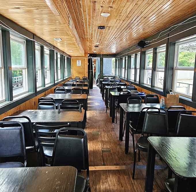 Tables and chairs in the dining car mean you can enjoy a meal while mountains roll past your window.