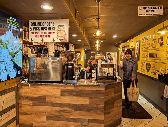 The wooden counter and vintage signage create that cozy coffee shop vibe we all secretly crave daily.