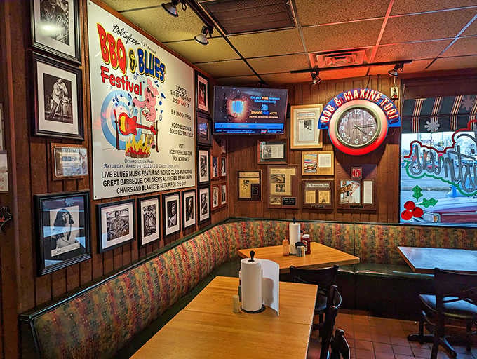 Cozy booths adorned with local memorabilia create the perfect atmosphere for lingering over your barbecue feast.