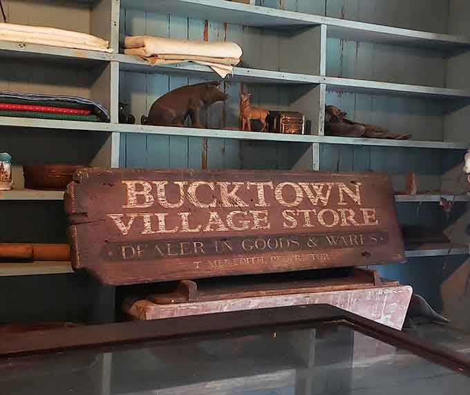 The original store sign connects today's visitors directly to the merchants who served this community generations ago.