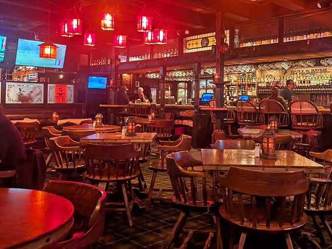 Red lighting creates an ambiance that's part cozy pub, part sophisticated lounge, all inviting and comfortable throughout.