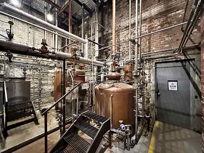Copper stills gleam against exposed brick, creating that perfect blend of old-world charm and modern bourbon-making precision you crave.
