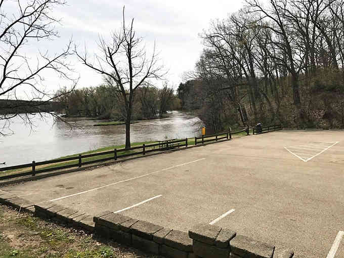 The parking lot after spring rains, when the river runs high and reminds you nature still calls the shots around here.