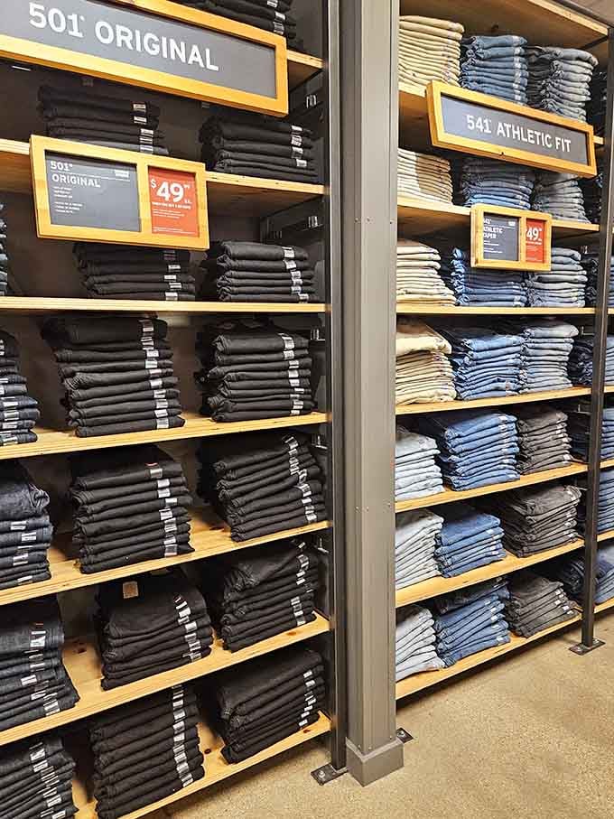 Levi's jeans stacked in perfect towers, the denim democracy where everyone can find their perfect fit and wash.