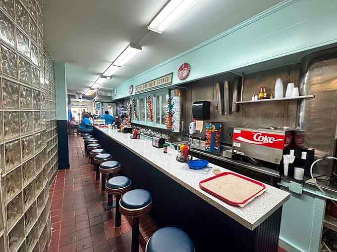 The classic diner counter with its row of stools represents American dining democracy at its finest and most delicious.