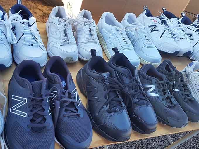 Athletic shoes arranged by color like a podiatrist's fever dream, offering comfort without the department store markup madness.
