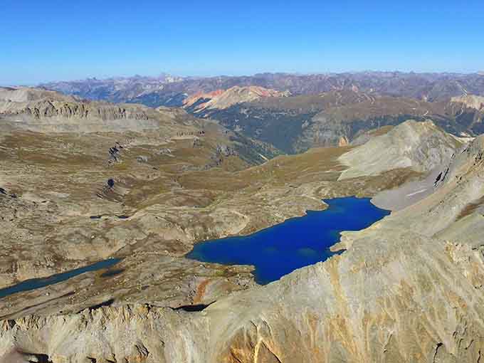 From above, the lake looks like someone spilled blue paint across the mountainside in the best way possible.
