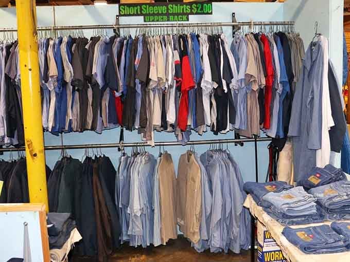 Racks of men's shirts organized by someone who understands that shopping shouldn't require a compass and survival skills to navigate.