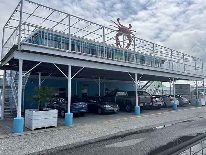 That rooftop deck with the crab sculpture announces this establishment's priorities louder than any billboard ever could manage.
