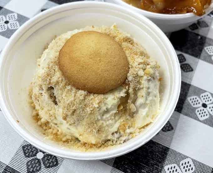 Banana pudding topped with a vanilla wafer, because some Southern traditions are simply too perfect to mess with.