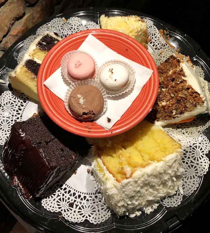 That dessert platter featuring macarons, brownies, and layer cakes is basically a sweet ending waiting to happen for you.